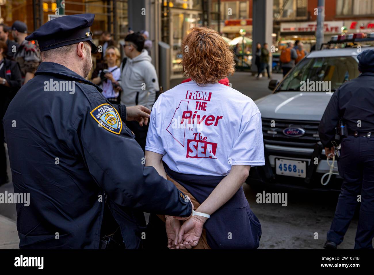 New York, United States. 14th Mar, 2024. Police escort handcuffed pro ...