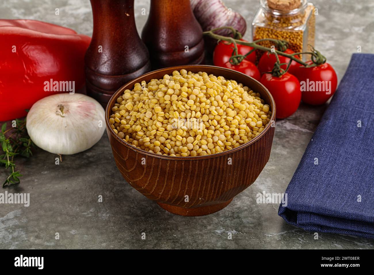 Dry ptitim heap in the bowl for cooking Stock Photo - Alamy