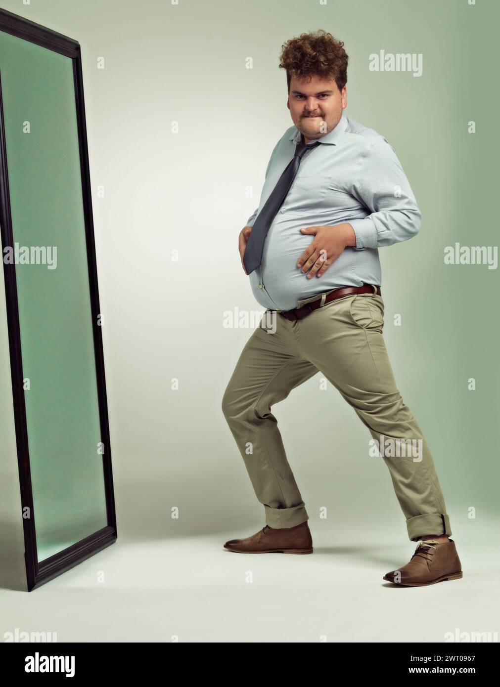 Funny, portrait and man happy with mirror, plus size and overweight ...