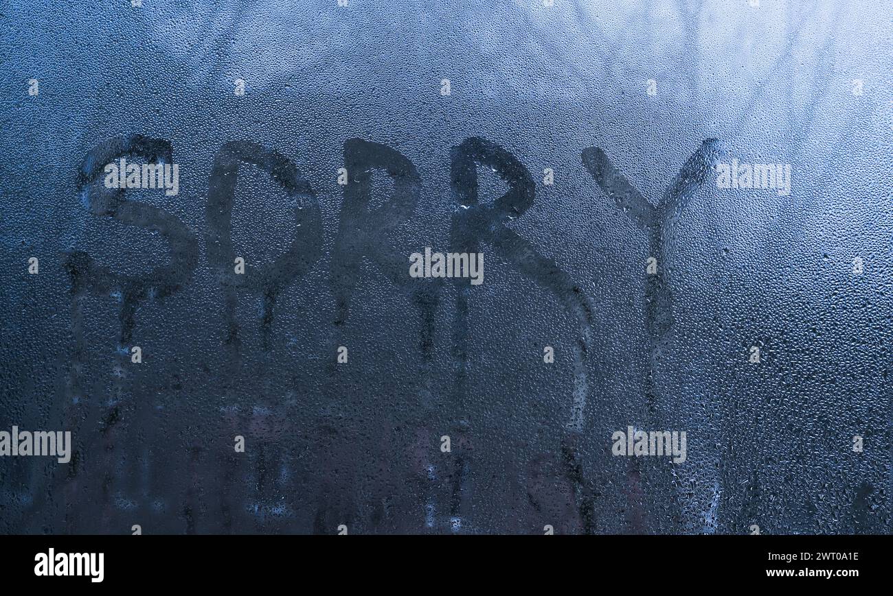 I'm sorry about the concept. The word sorry on the wet glass Stock ...