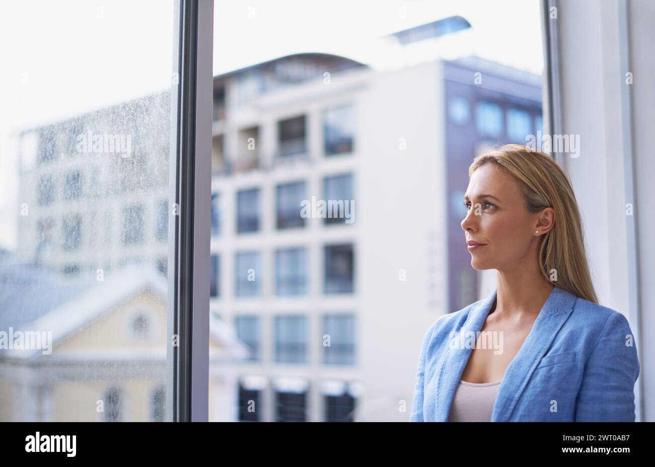 Thinking, window and serious business woman in office with ideas ...