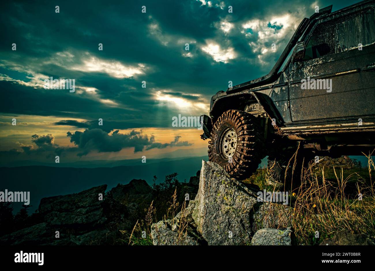 Offroad car on mountain road. Shock absorber for off road car. Car ...