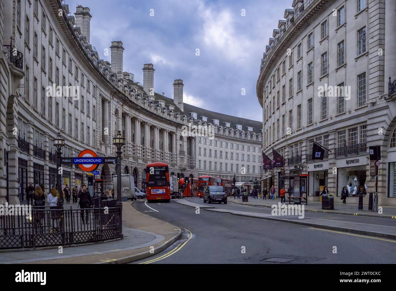 Regent Street London with historic architecture, shops, red double ...