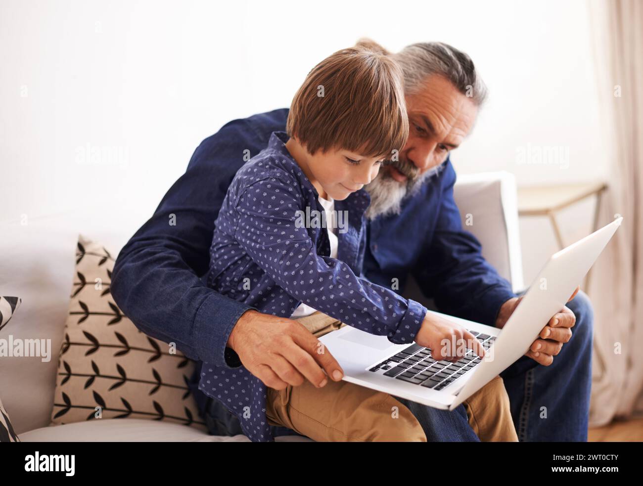 Grandfather, son and laptop in lounge with love and bonding together ...