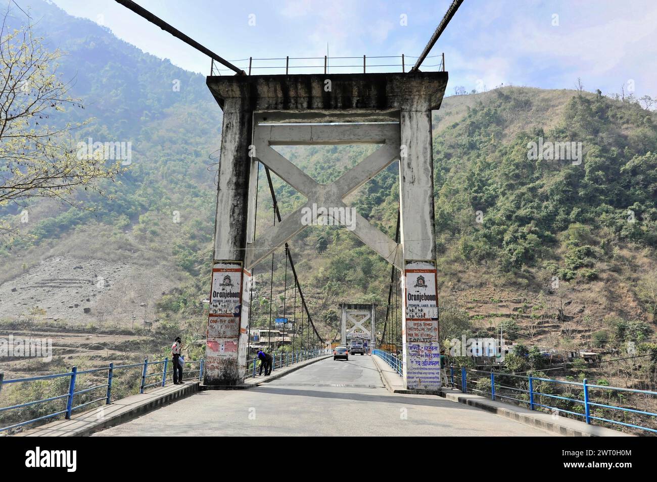 Bridge over a river with people and traffic signs in daylight ...