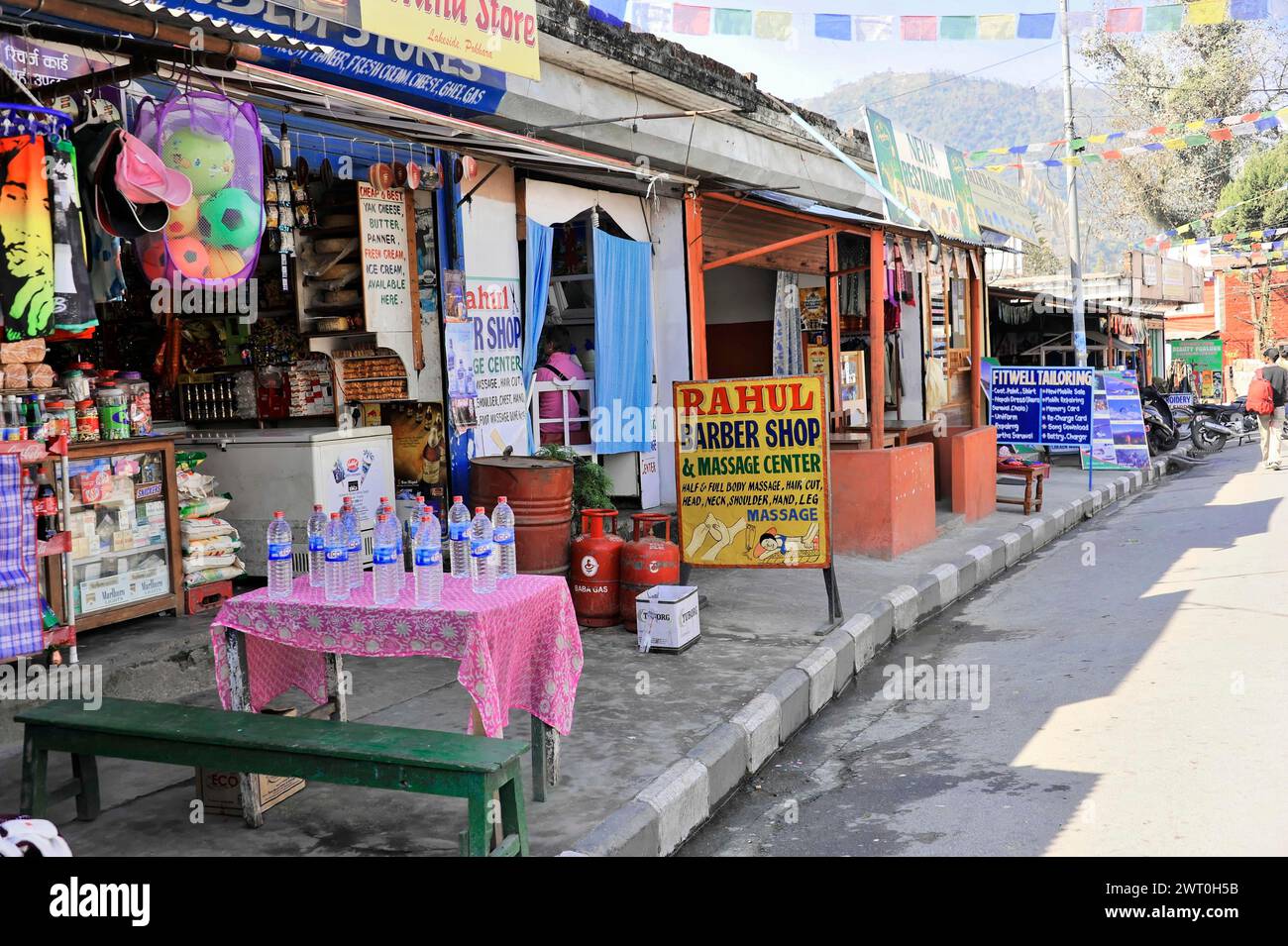 Street scene with various shops and goods on display, Pokhara Valley ...