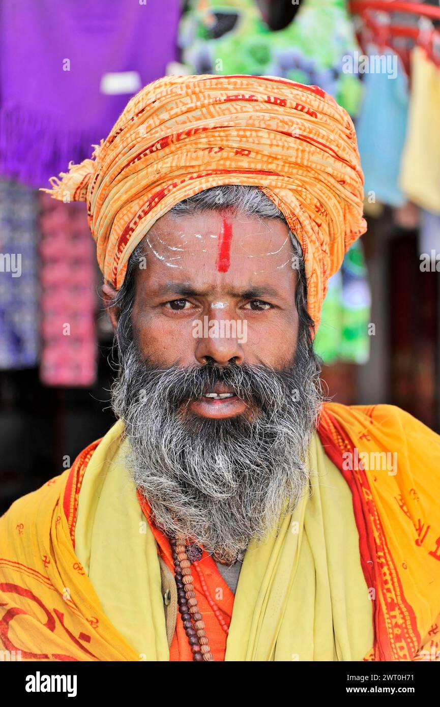Portrait of a man with beard and colourful turban in traditional ...