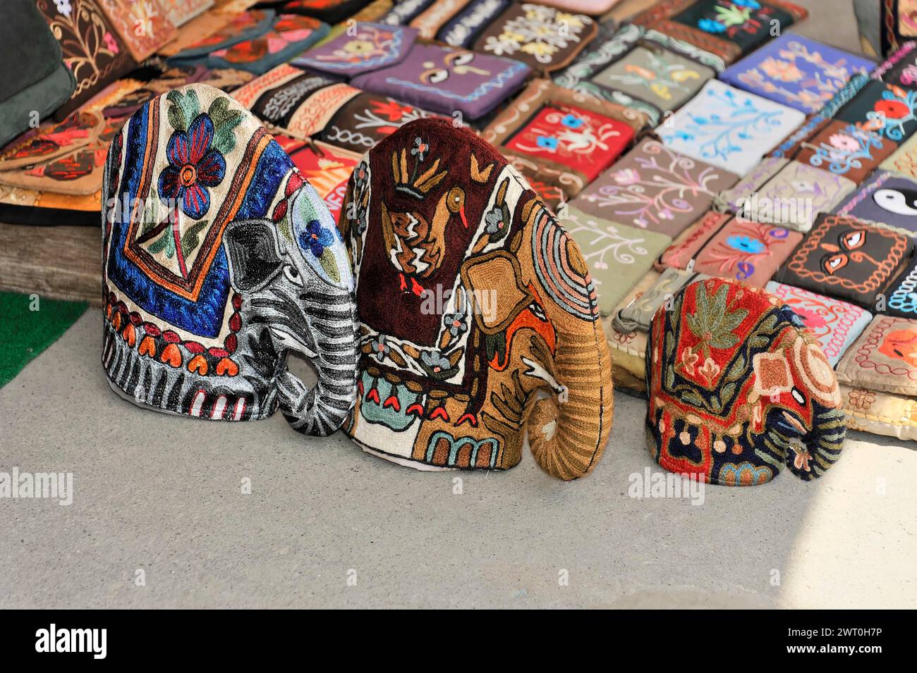 Colourful, handmade caps with traditional patterns for sale at a market ...