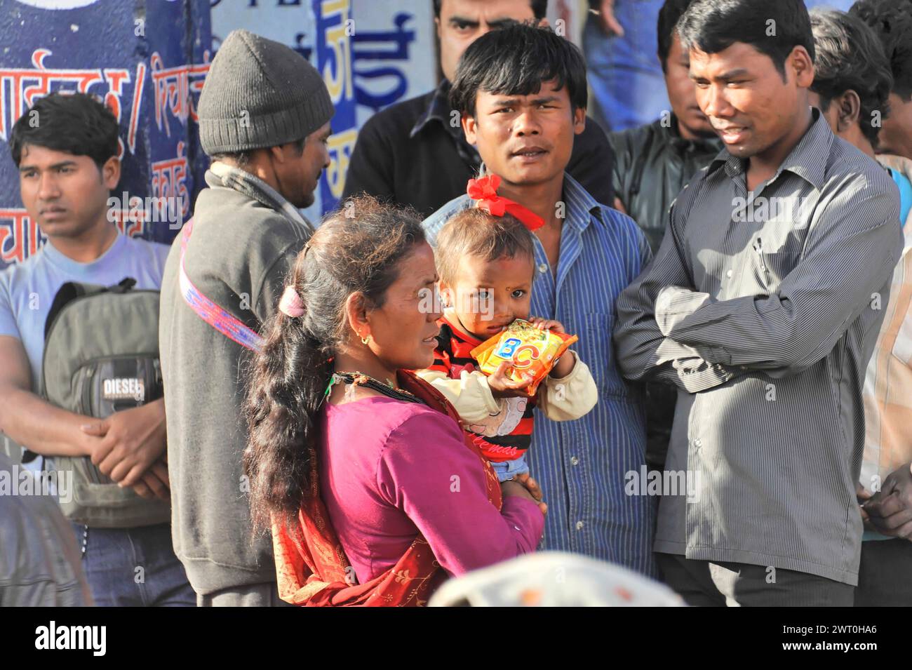 Group of people chatting while a child looks at one, impressions of ...