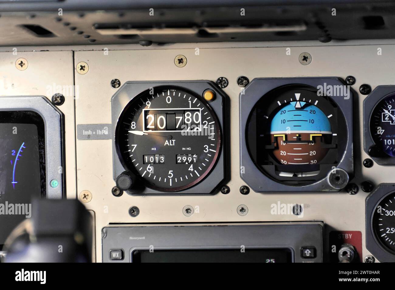 Cockpit of an aeroplane with focus on altimeter and speedometer ...