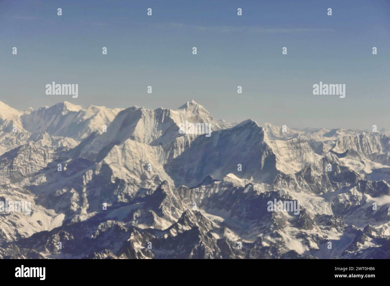 Aerial view of snow-covered mountain peaks and valleys, impressions ...