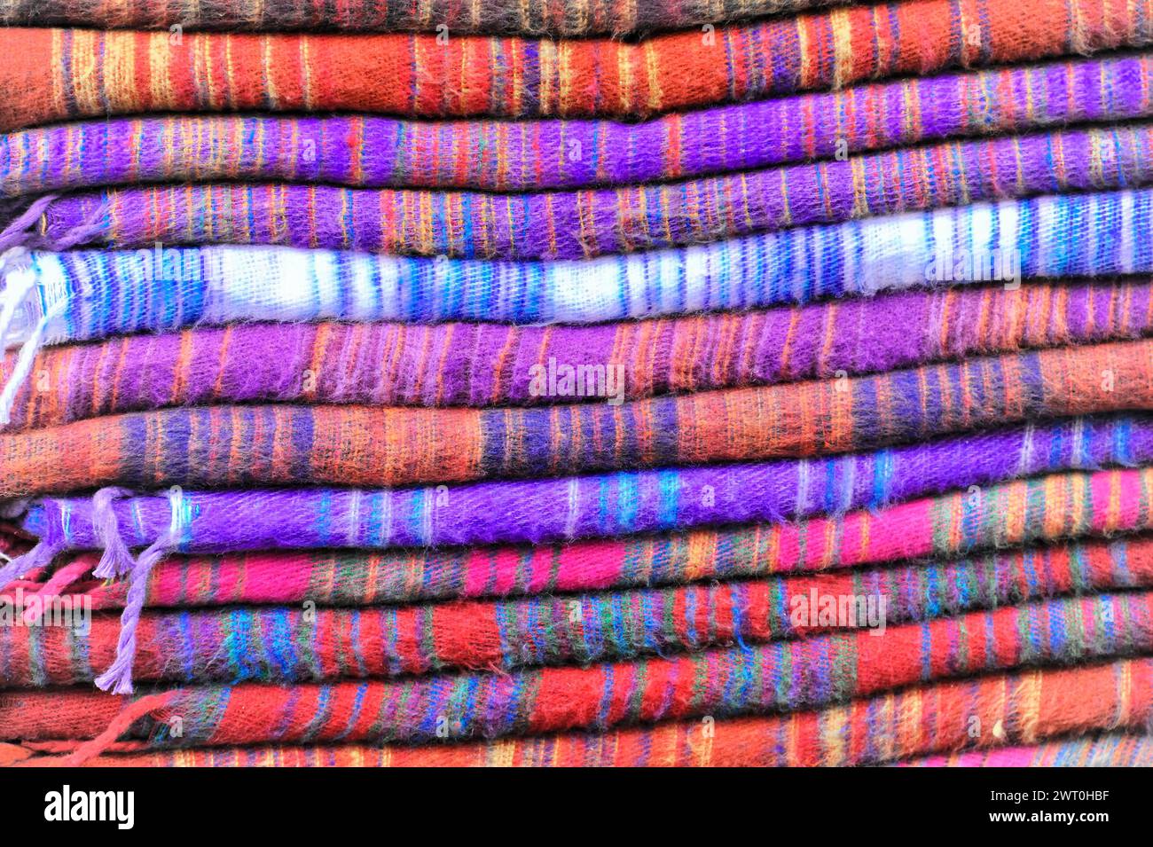 Stacked colourful woven blankets with eye-catching texture, Impressions ...
