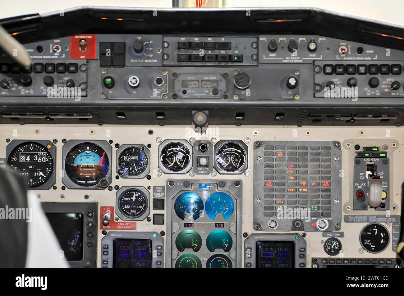 Cockpit of an aeroplane with various instruments and screens ...