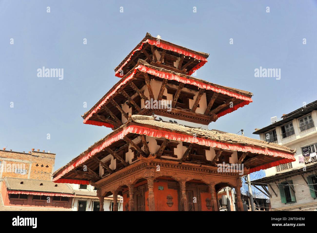 Temple in traditional Nepalese pagoda style under a blue sky, Kathmandu ...