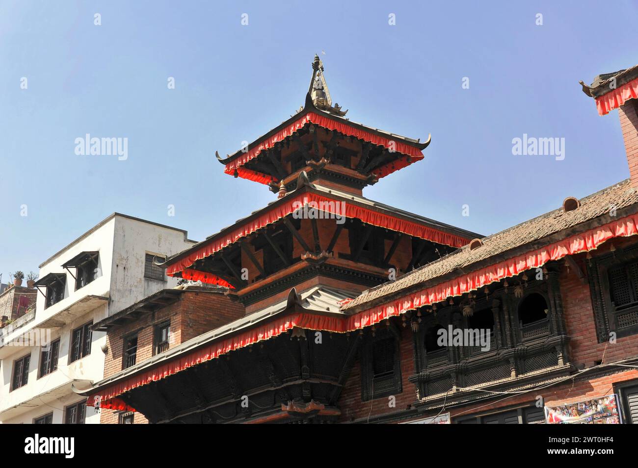 Historic pagoda-style temple in front of a clear sky, Kathmandu Valley ...