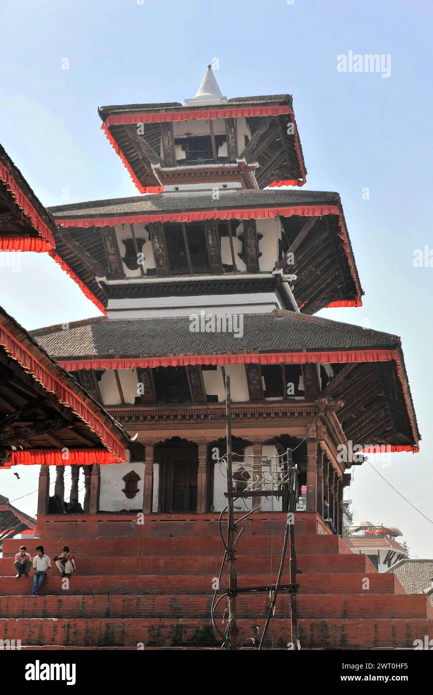 Multi-storey temple in Nepal with red decorations and steps, Kathmandu ...
