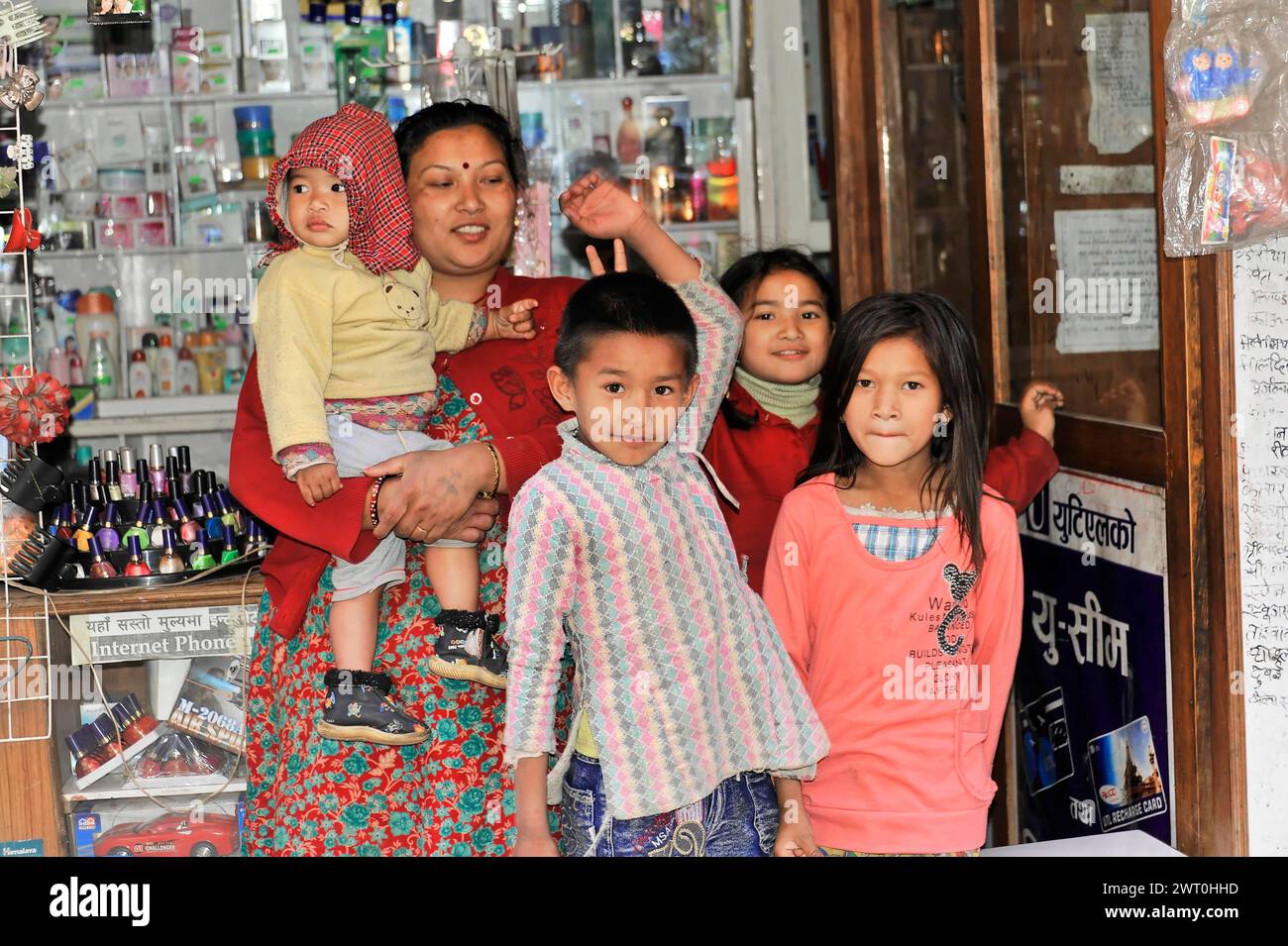Happy family with several children smiling in a shop, Kathmandu Valley, Kathmandu, Nepal Stock ...