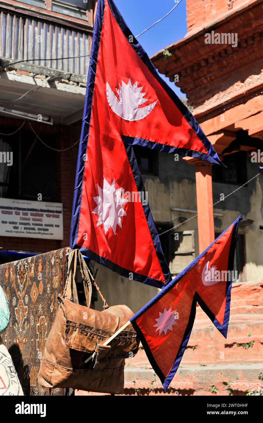 National flags of Nepal hanging next to a cloth bag, Kathmandu Valley ...