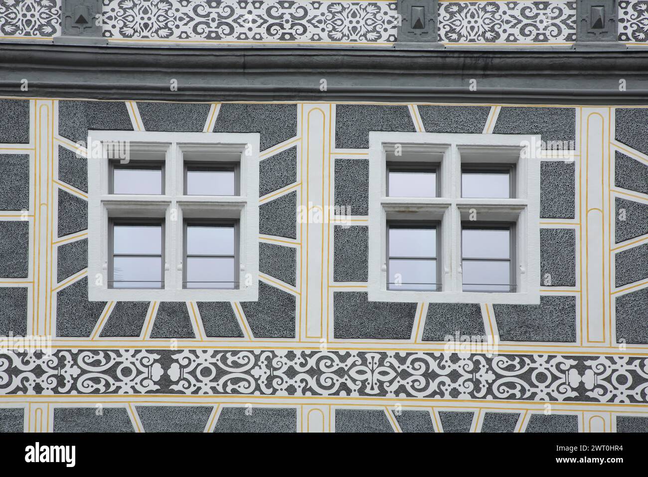 Renaissance house wall with two windows and sgraffiti, decorations ...