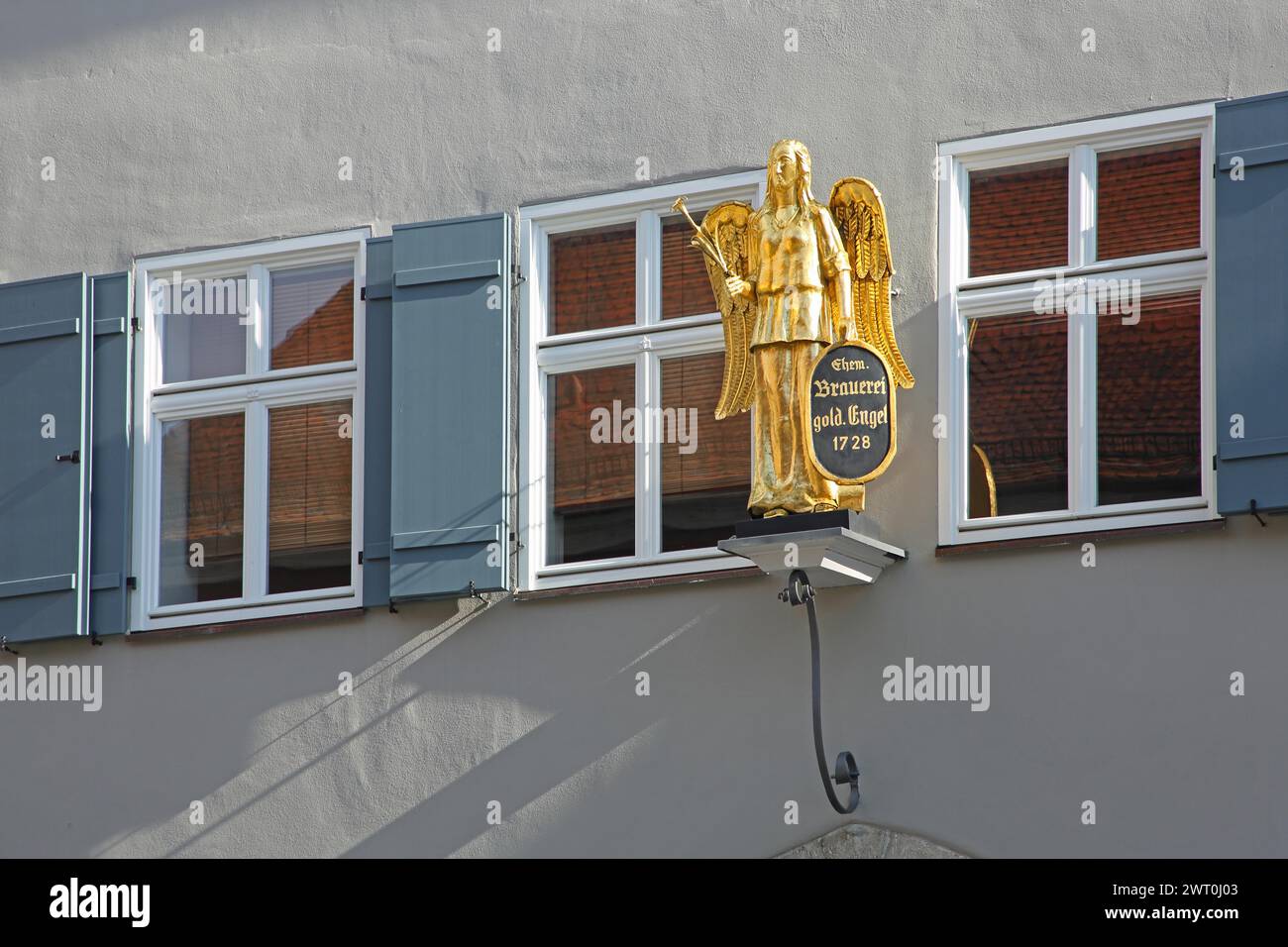 House wall with three windows and nose sign of the brewery Goldener ...