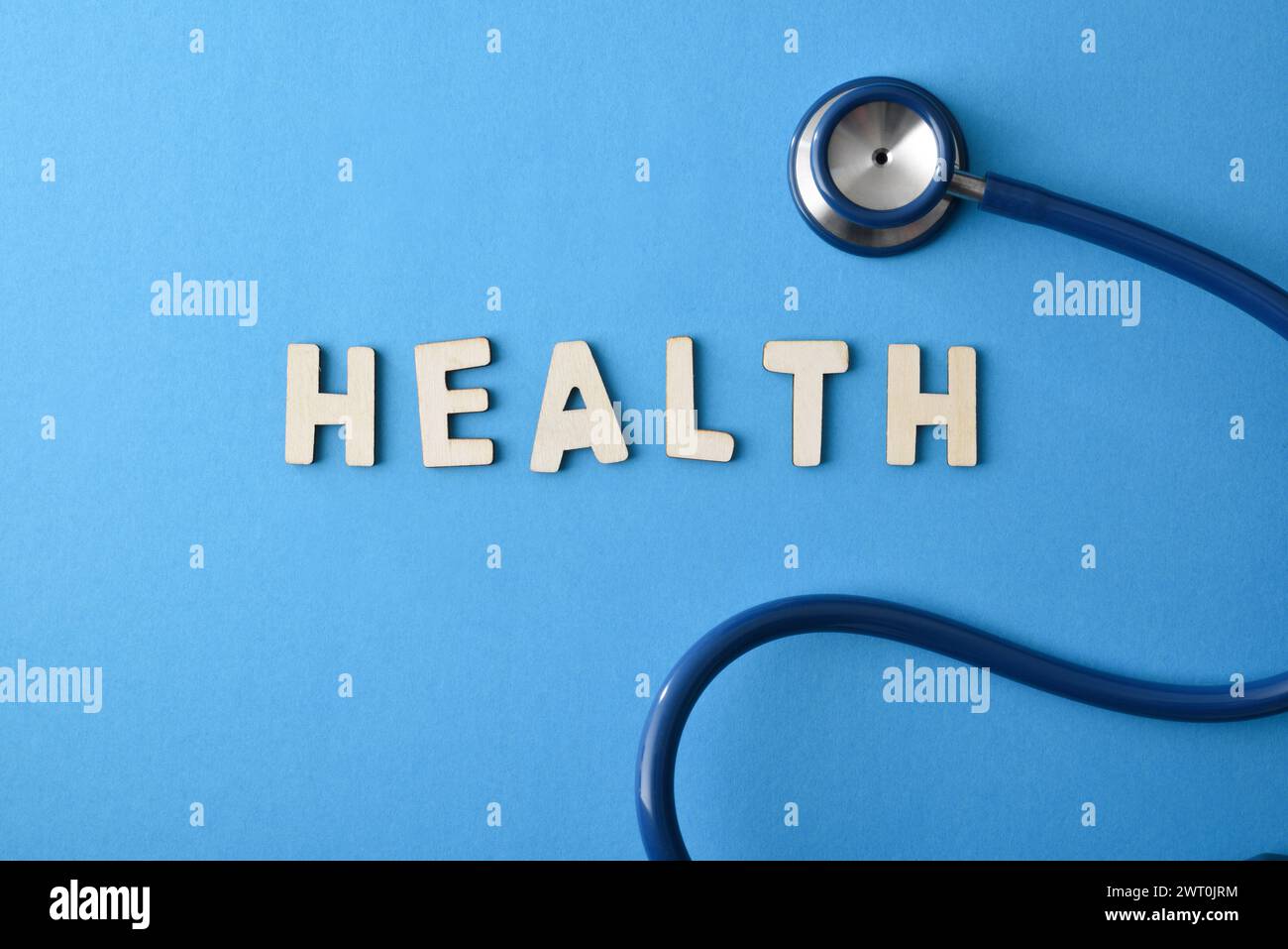 Health background with stethoscope and health message with wooden ...