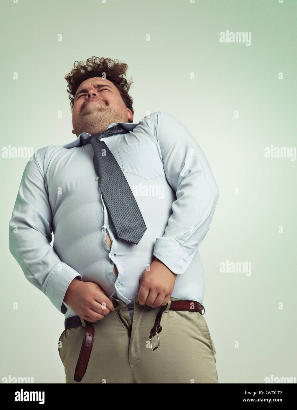 Frustrated man, pants and plus size with big waist in obesity or ...