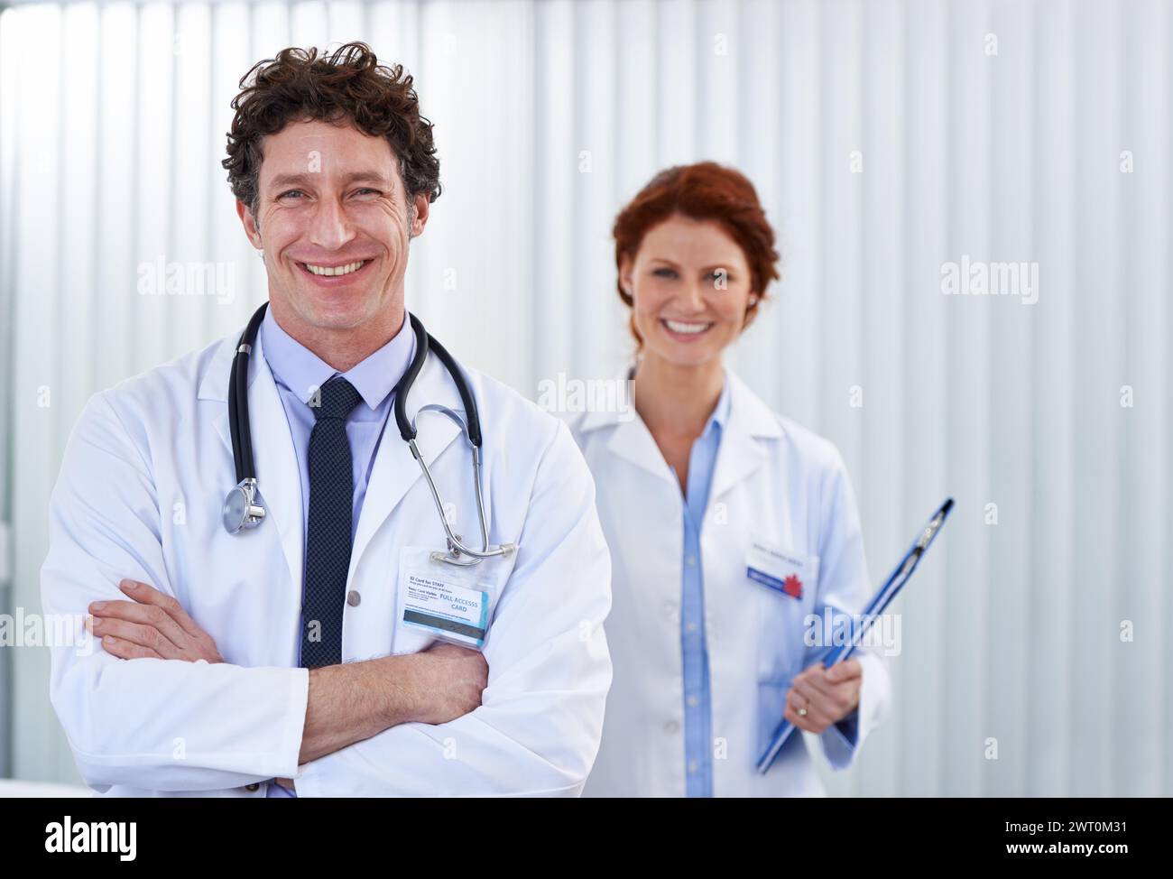 Doctors, man and woman with arms crossed in portrait for team ...