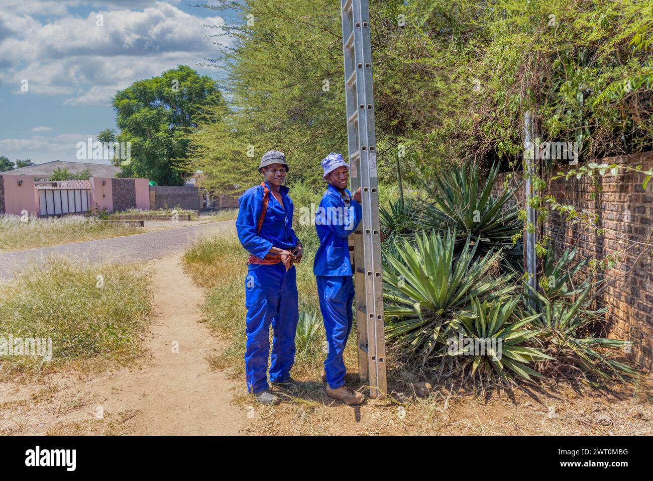 African workers for optical fiber installation, working outdoor ,they ...