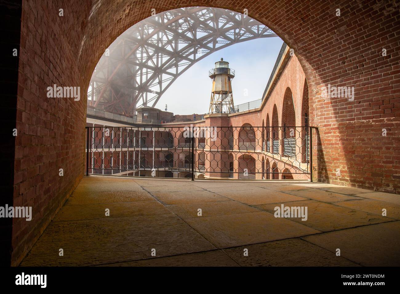 View of Lighthouse Through Arch Under A Bridge Stock Photo - Alamy