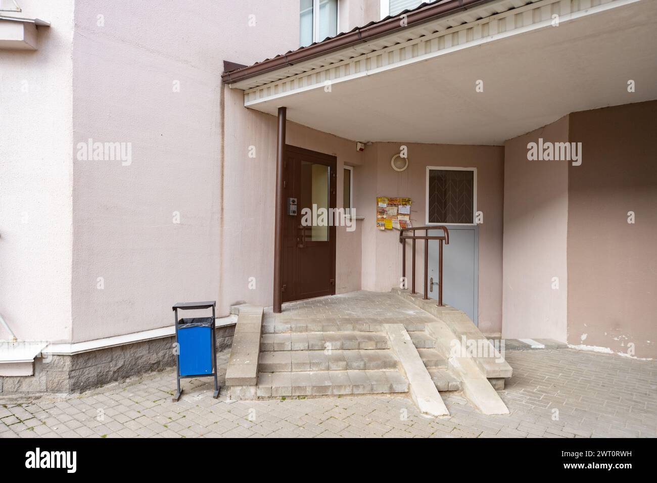 Outside view of an apartment building entrance Stock Photo - Alamy