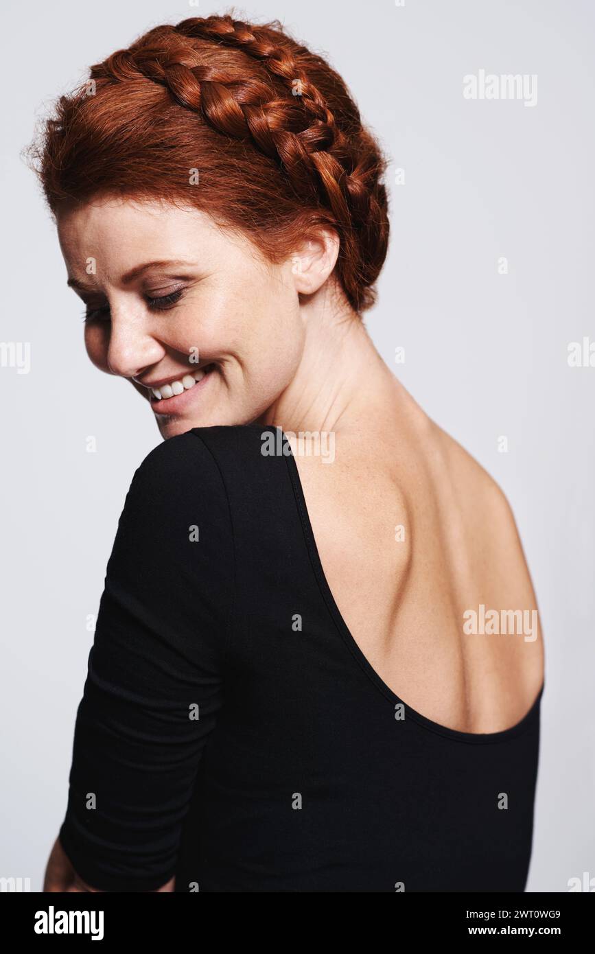 Smile, beauty and haircare with plait for woman person, studio and ...