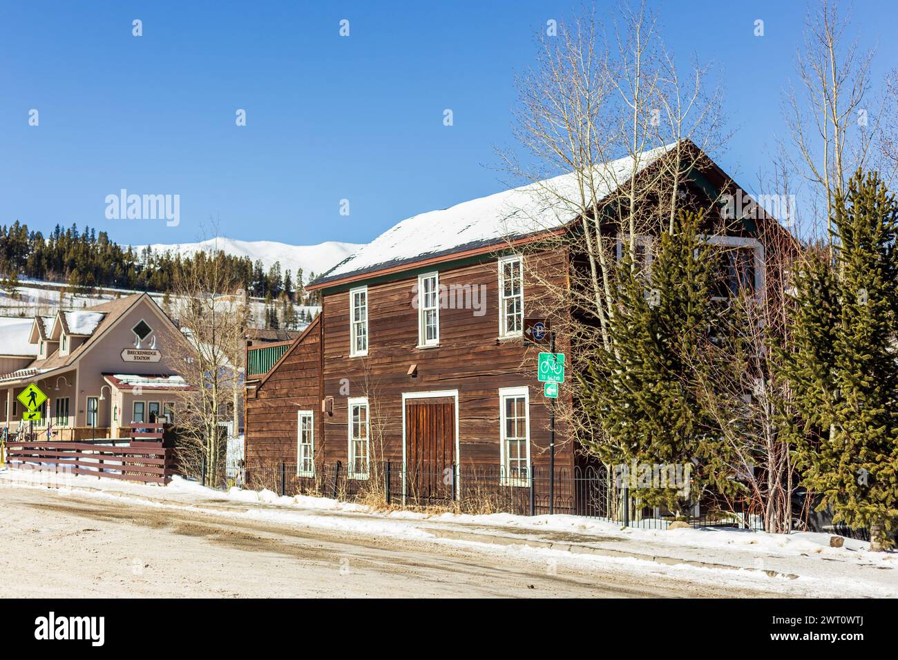 Winter View of Historic Buildings with Snow-Covered Mountains Stock ...