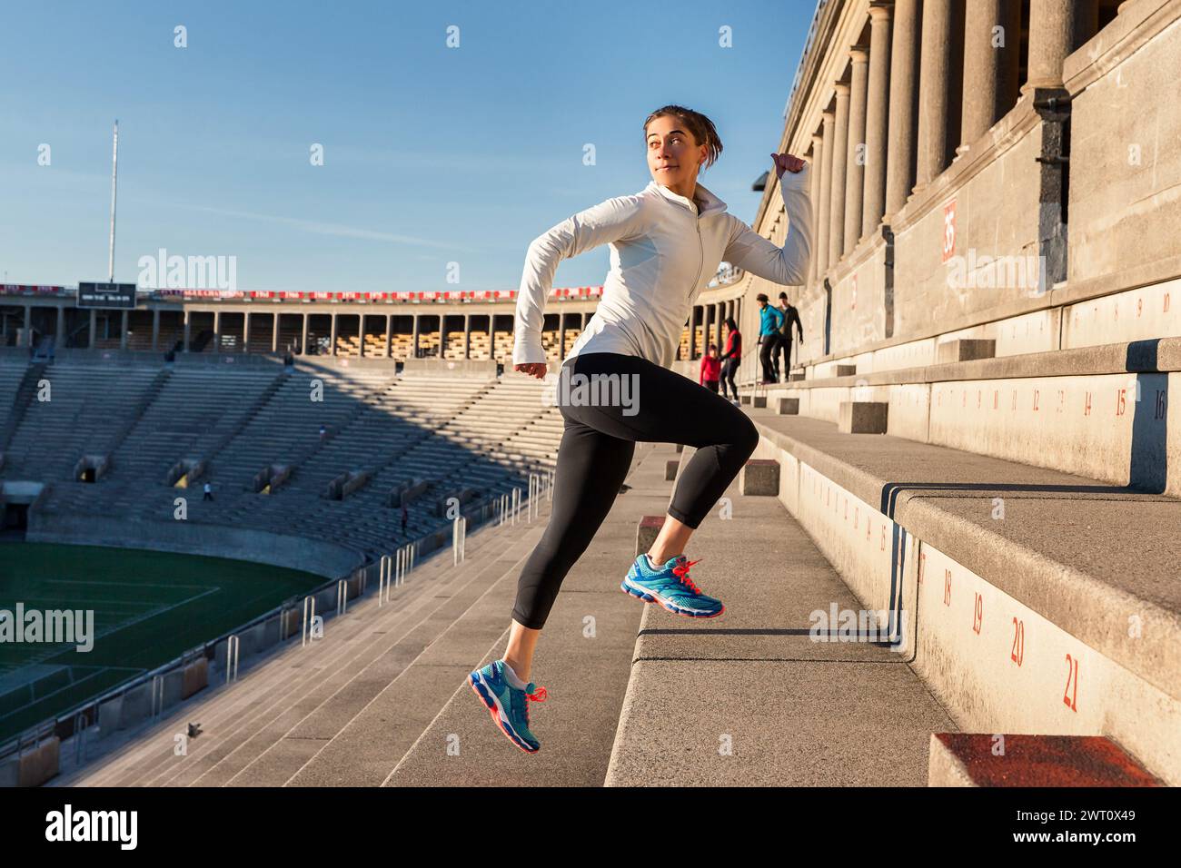 Female Runner on Stairs in Football Stadium at Dawn Stock Photo - Alamy
