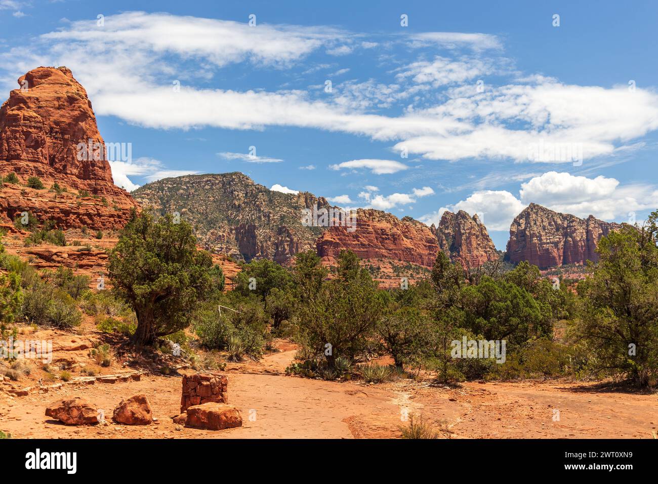 Red sandstone towers rise majestically in Sedona landscape Stock Photo ...