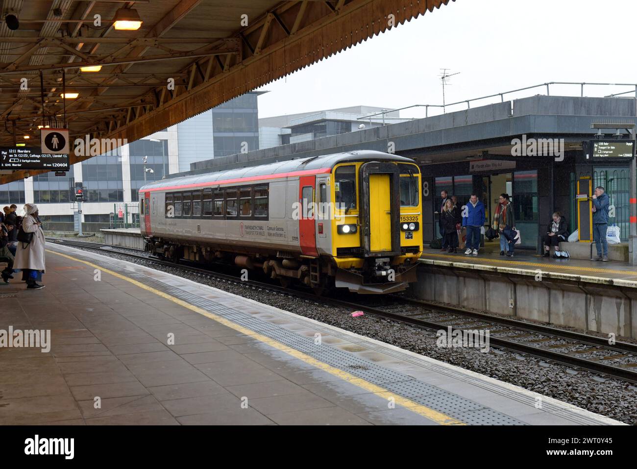 Passengers getting on a Transport For Wales Class 150 Sprinter DMU ...