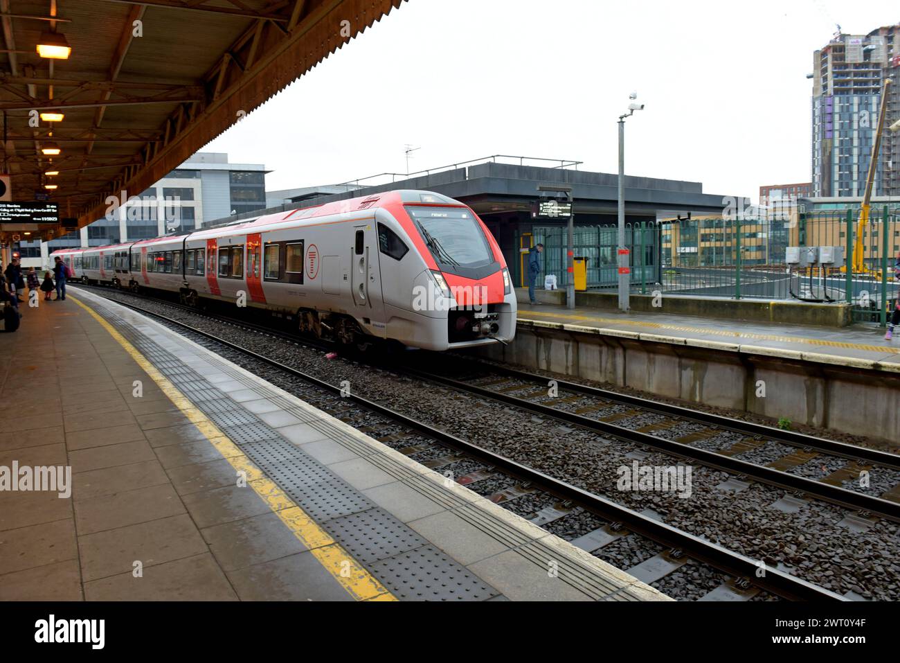 Passengers getting on a new Transport For Wales Class 231 Stadler Flirt ...