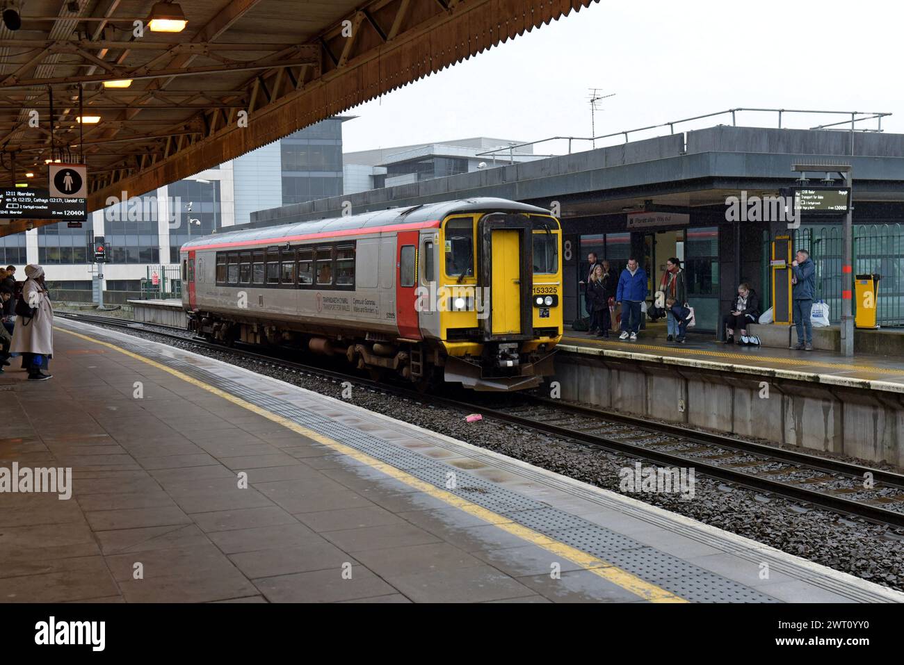 Passengers getting on a Transport For Wales Class 150 Sprinter DMU ...