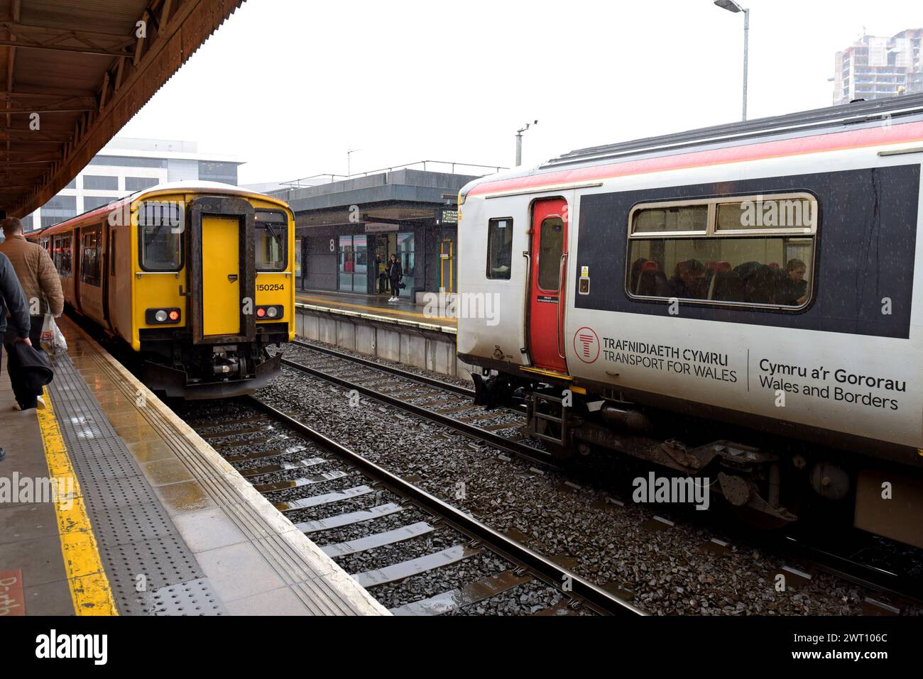 Passengers getting on a Transport For Wales Class 150 Sprinter DMU ...
