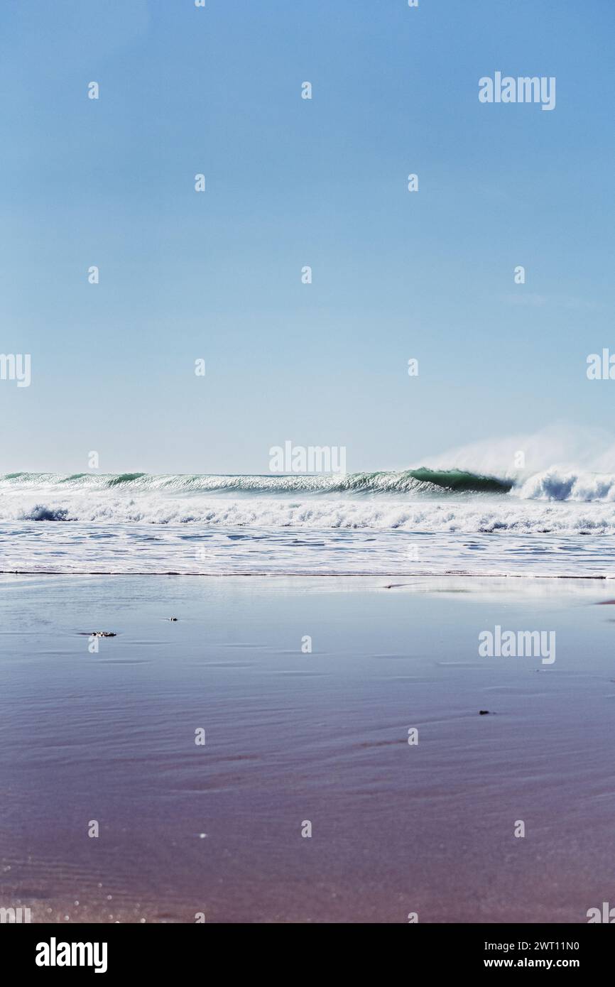 wave breaking on the seashore, high contrast, shadows Stock Photo - Alamy