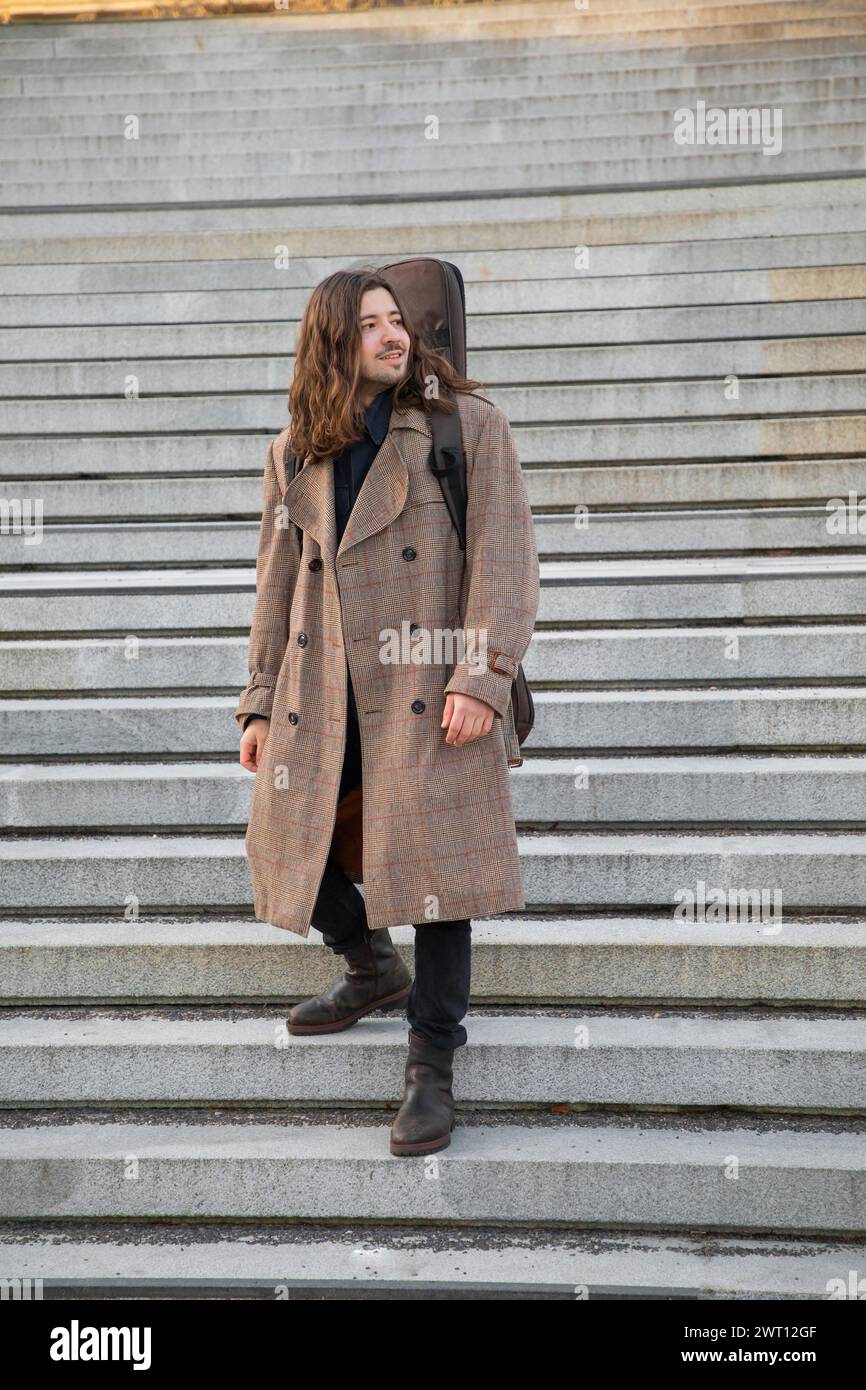 young handsome guy with long dark hair Stock Photo - Alamy