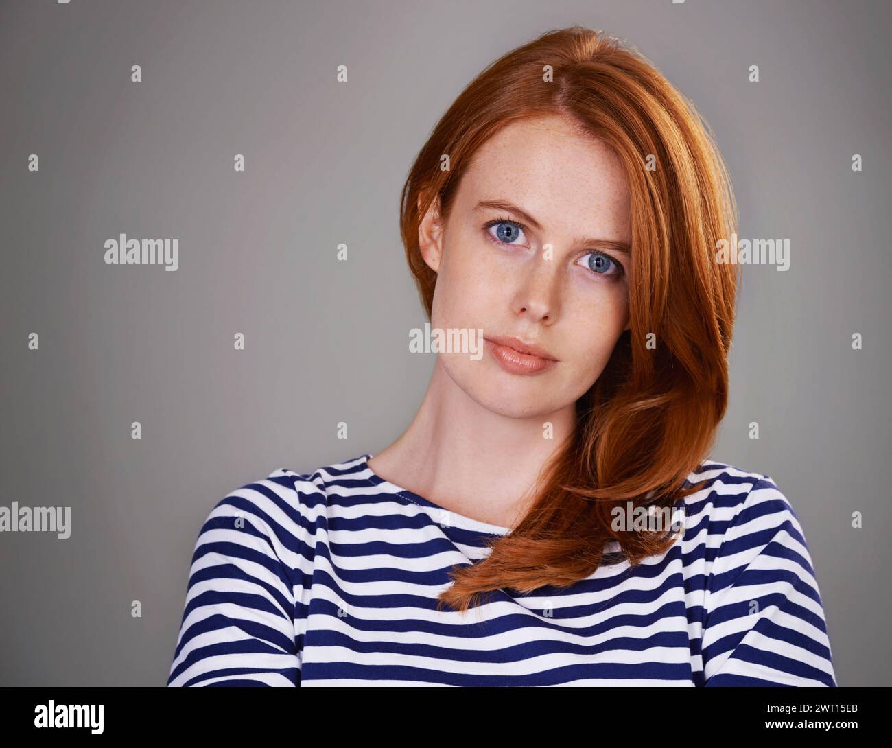 Serious, gray background and portrait of business woman with red hair ...