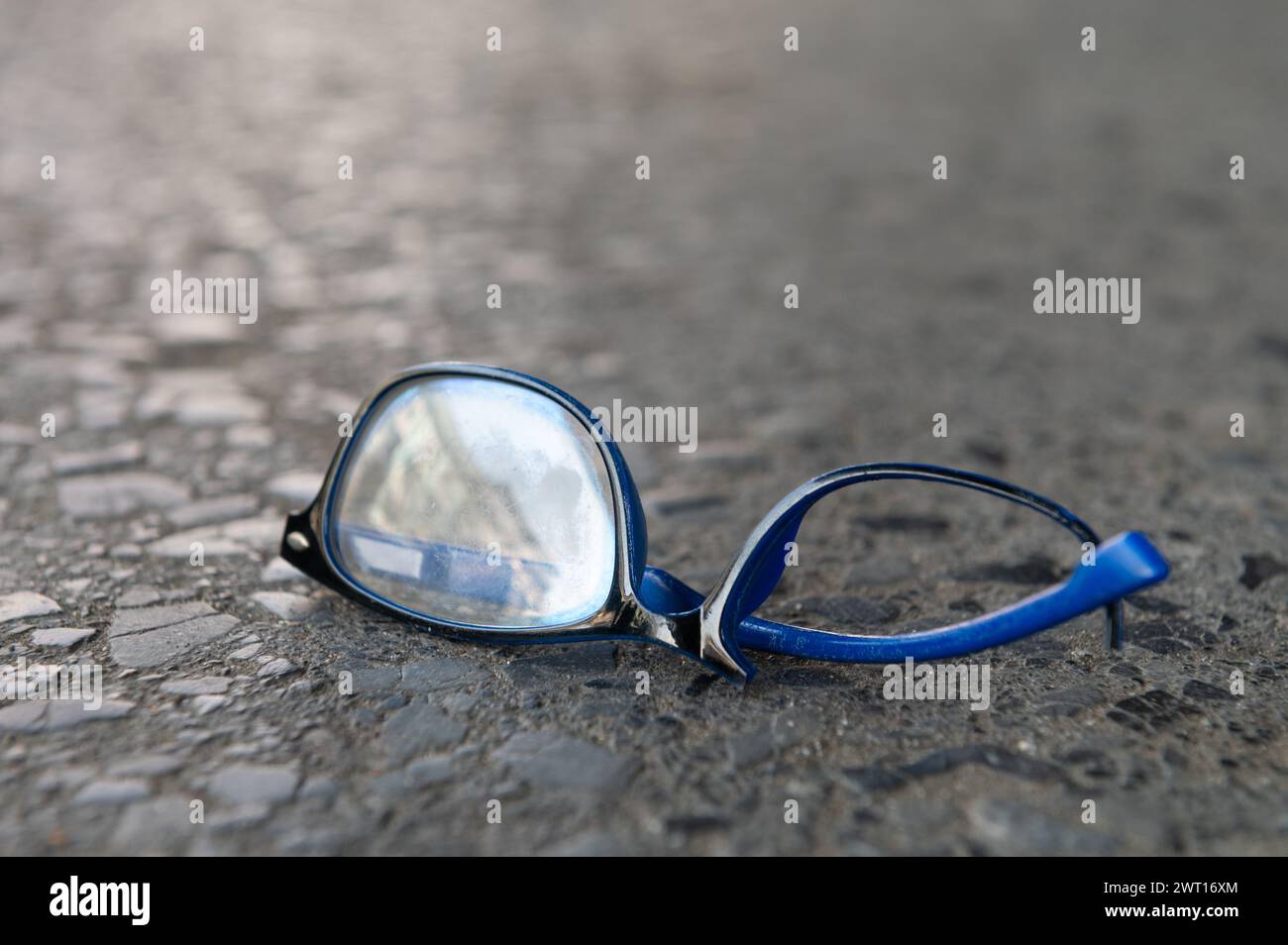 Broken glasses plastic frame damage fall on the concrete floor Stock ...