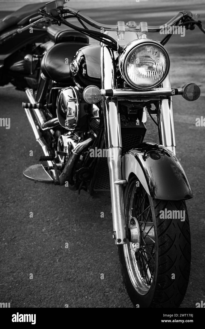 Black cruiser type motorcycle parked on side of the road. Motorcycle ...