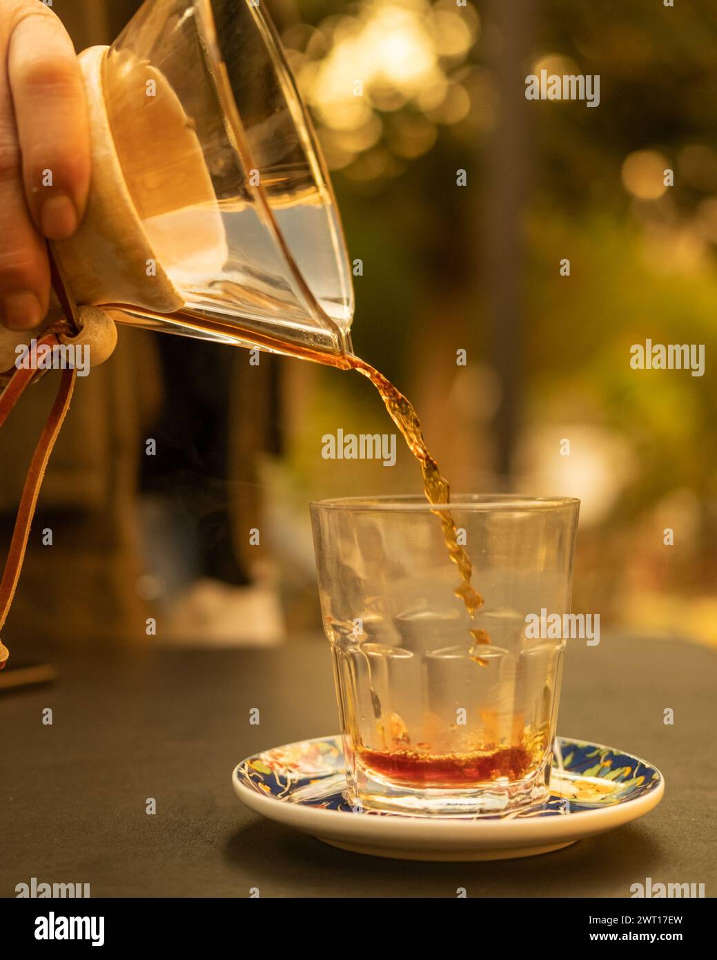 Black coffee pouring cup slow hi-res stock photography and images - Alamy