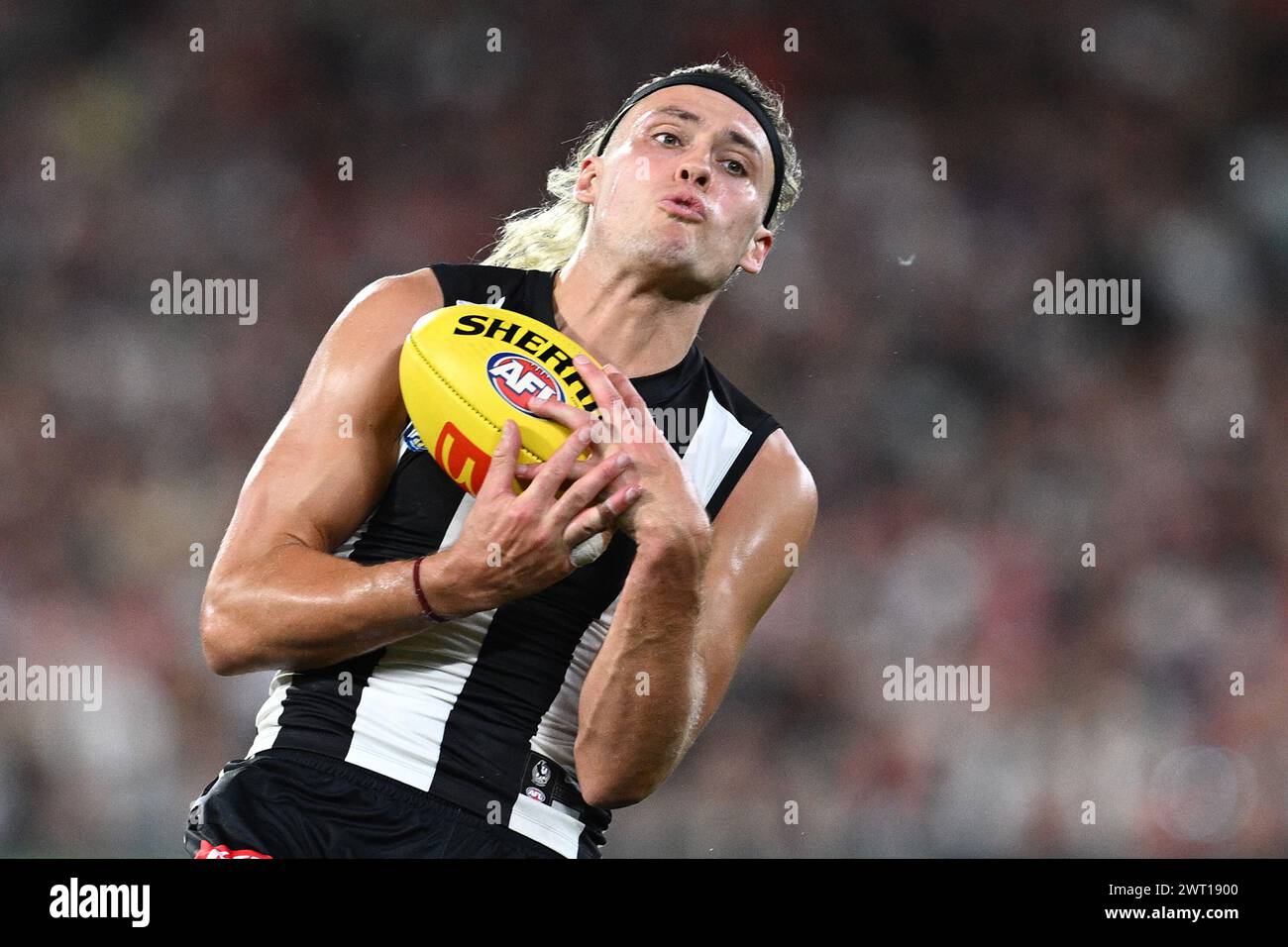 Melbourne, Australia. 15th Mar, 2024. Darcy Moore of Collingwood takes ...