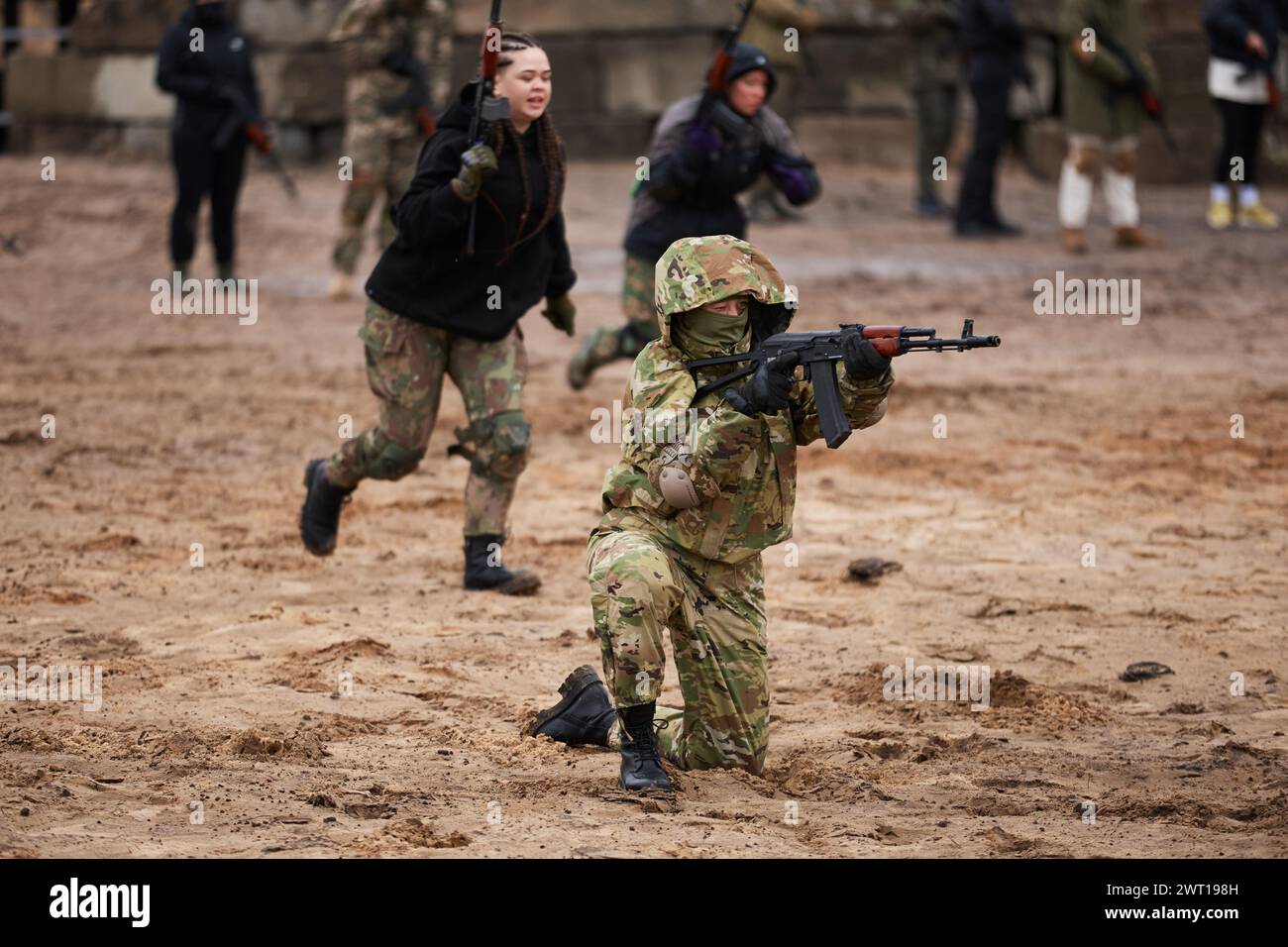 Ukrainian women training to shoot with rifles on a military polygon ...