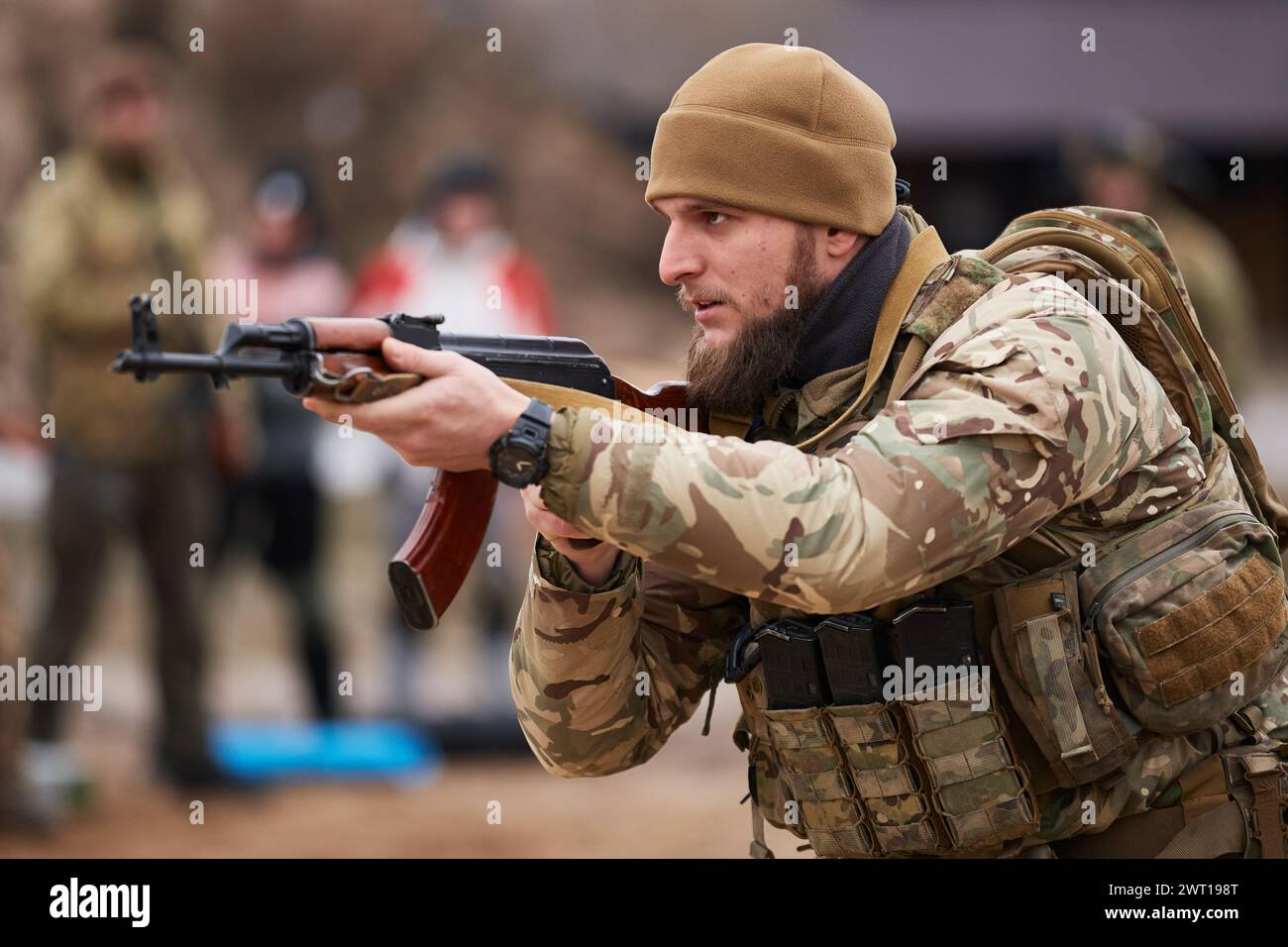 Ukrainian soldier training the recruits to use the AK rifle on a ...