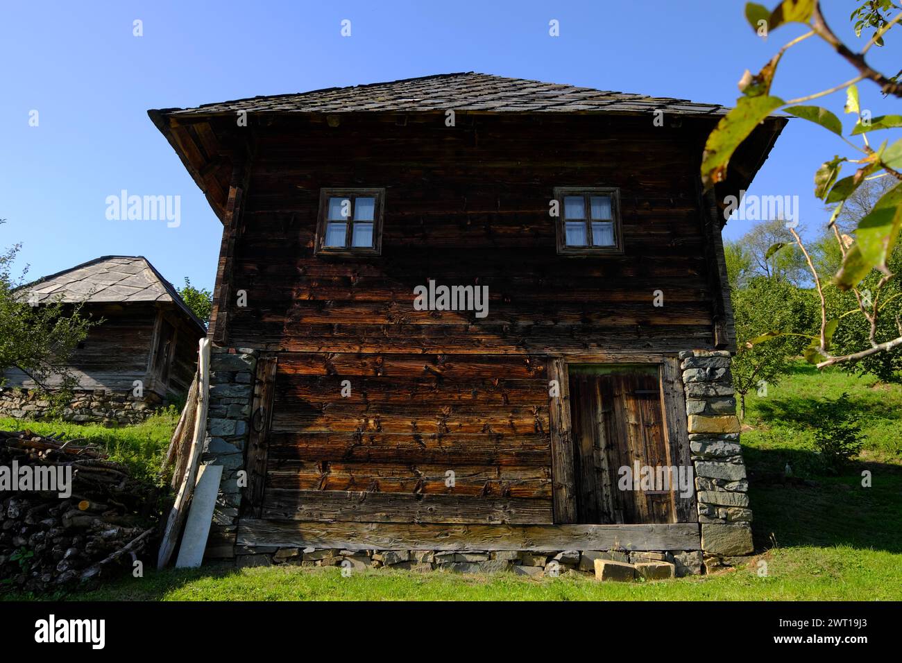a traditional log cabin with roof of slate in South-Western Serbia ...