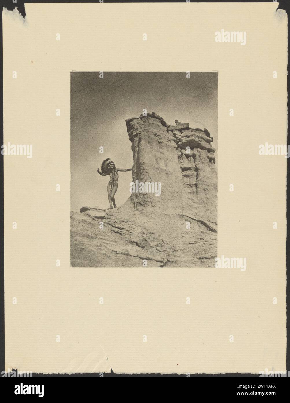 Woman in Indian Costume in the Desert Posed Next to a Large Rock ...