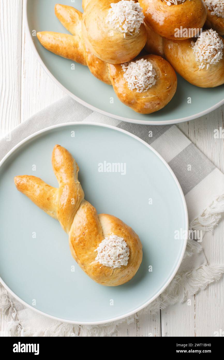 Bunny twist bake decorated with coconut flakes Easter bun closeup on ...
